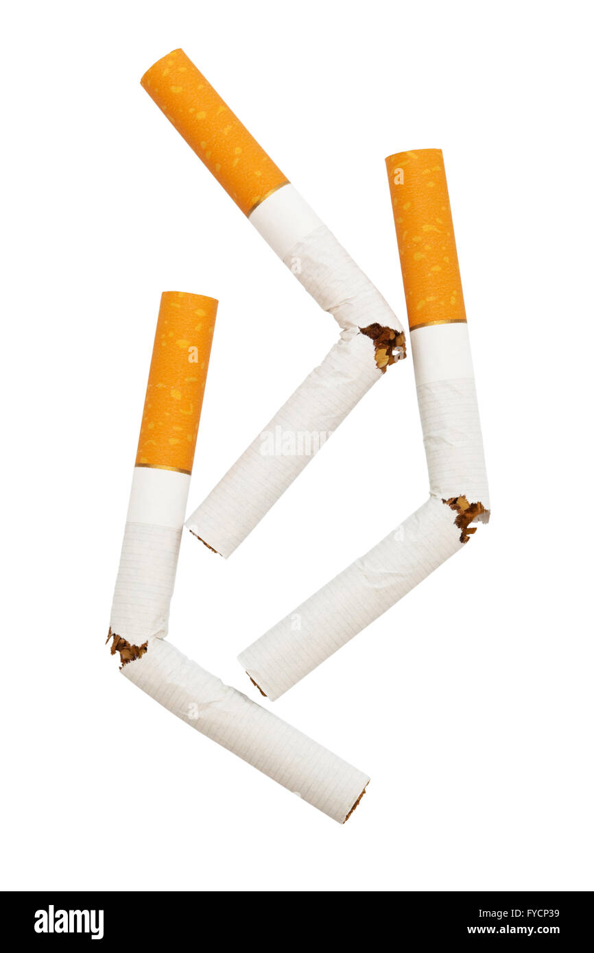 three broken cigarette on a white background Stock Photo - Alamy