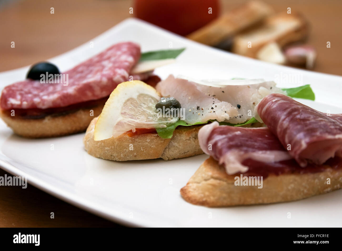 Tasty homemade tapas with different fillings on the table Stock Photo ...