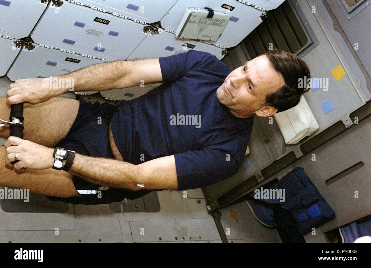 NASA astronaut and commander Astronaut Ronald Grabe exercises on the ...