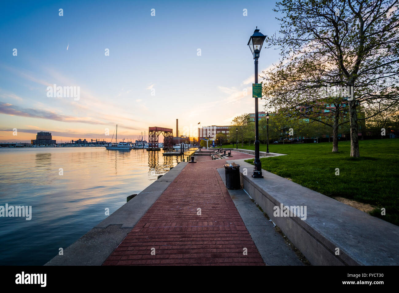 Walkway on the waterfront at sunset, in Canton, Baltimore, Maryland ...