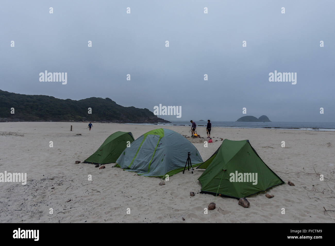 Young adults go hiking and camping in Tai Long Wan, next to Ham Tim ...