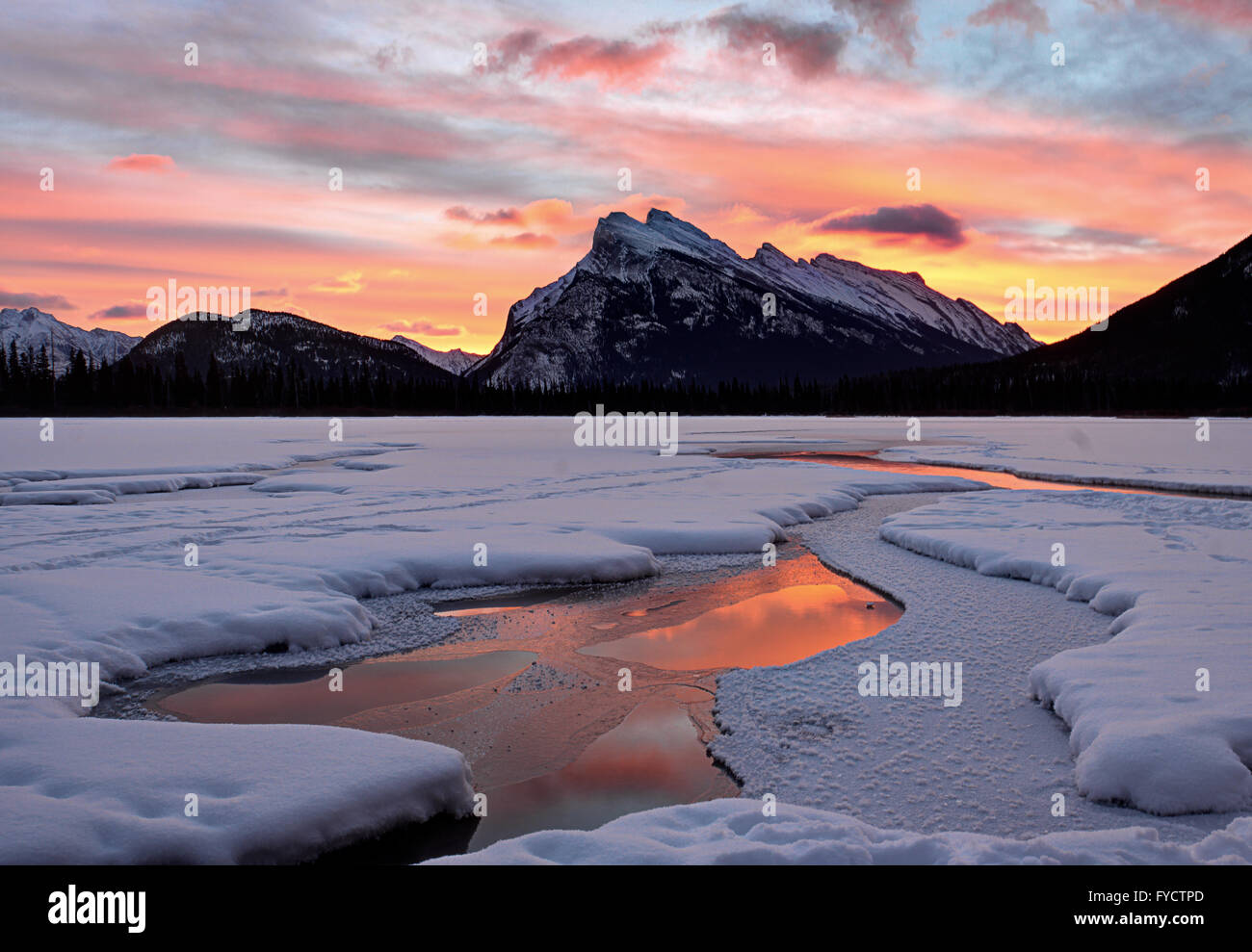 A winter sunrise at Vermilion Lakes in Banff, Alberta with Mt. Rundle ...