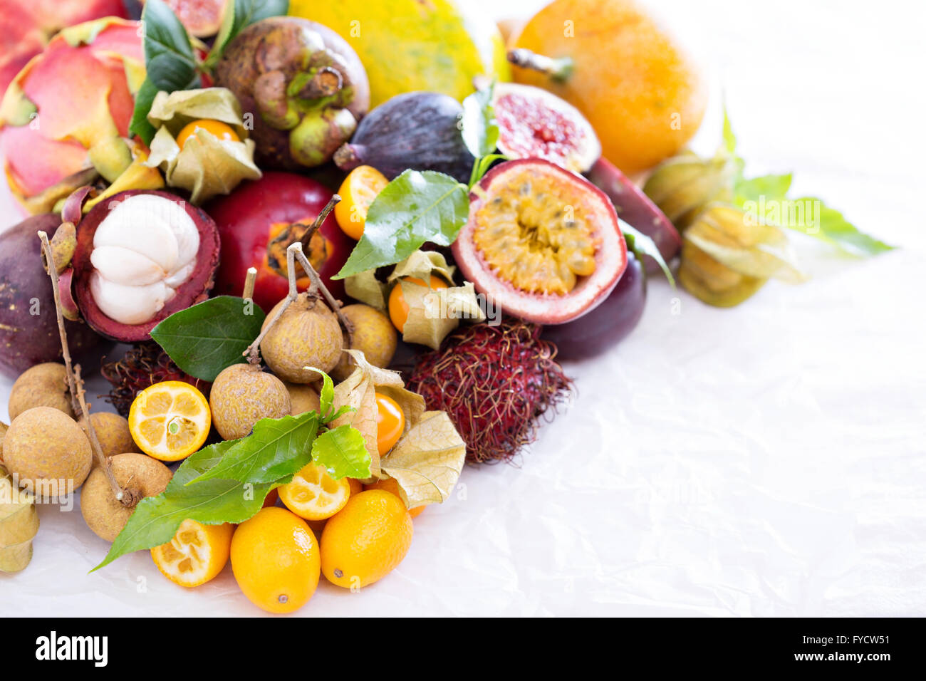 Exotic fruits on white background Stock Photo - Alamy