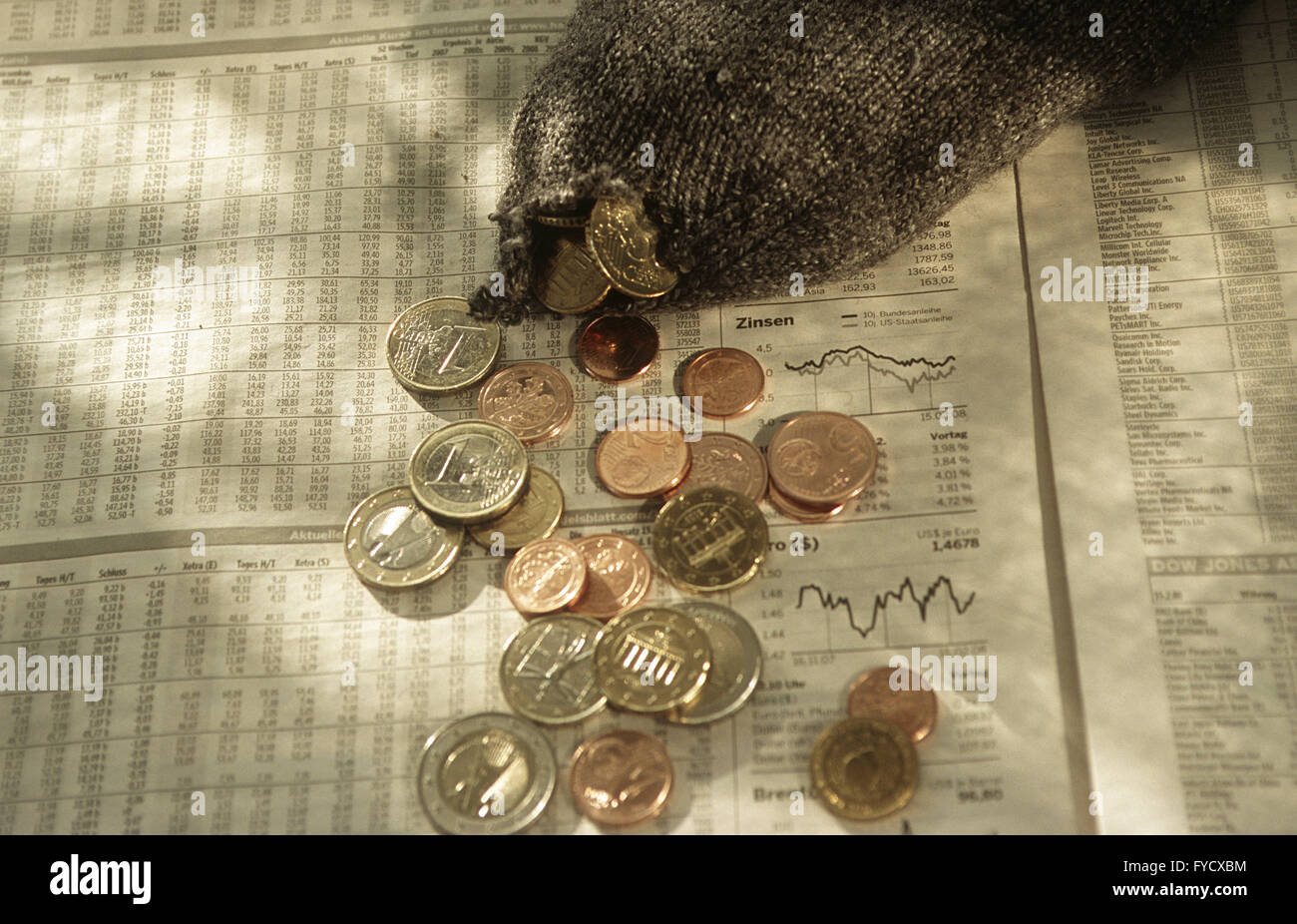 Money sock with coins Stock Photo - Alamy