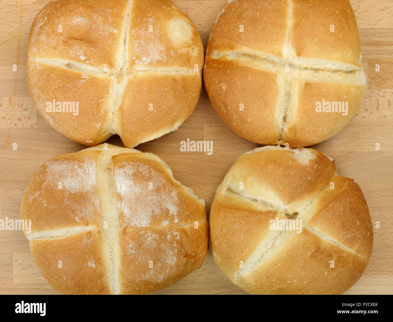 Fresh bread rolls isolated on a kitchen bench Stock Photo - Alamy
