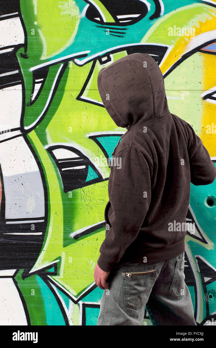 Young boy before graffiti Stock Photo - Alamy