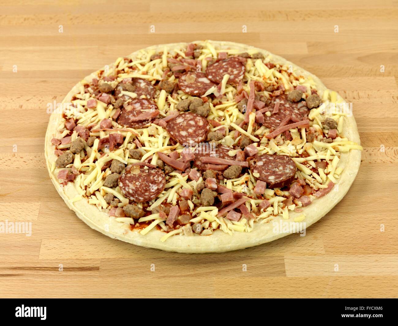 Fresh made pizza isolated on a kitchen bench Stock Photo - Alamy