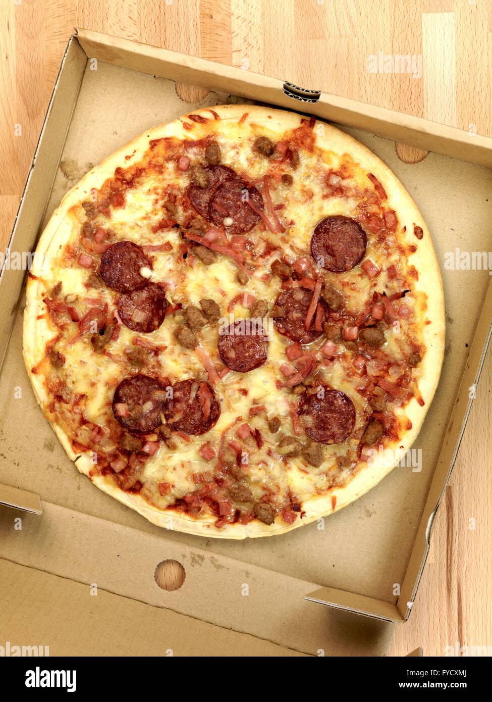 Freshly cooked takeaway pizza on a kitchen bench Stock Photo - Alamy