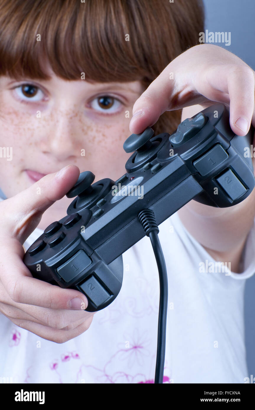 Picture of a young with freckles playing games Stock Photo - Alamy