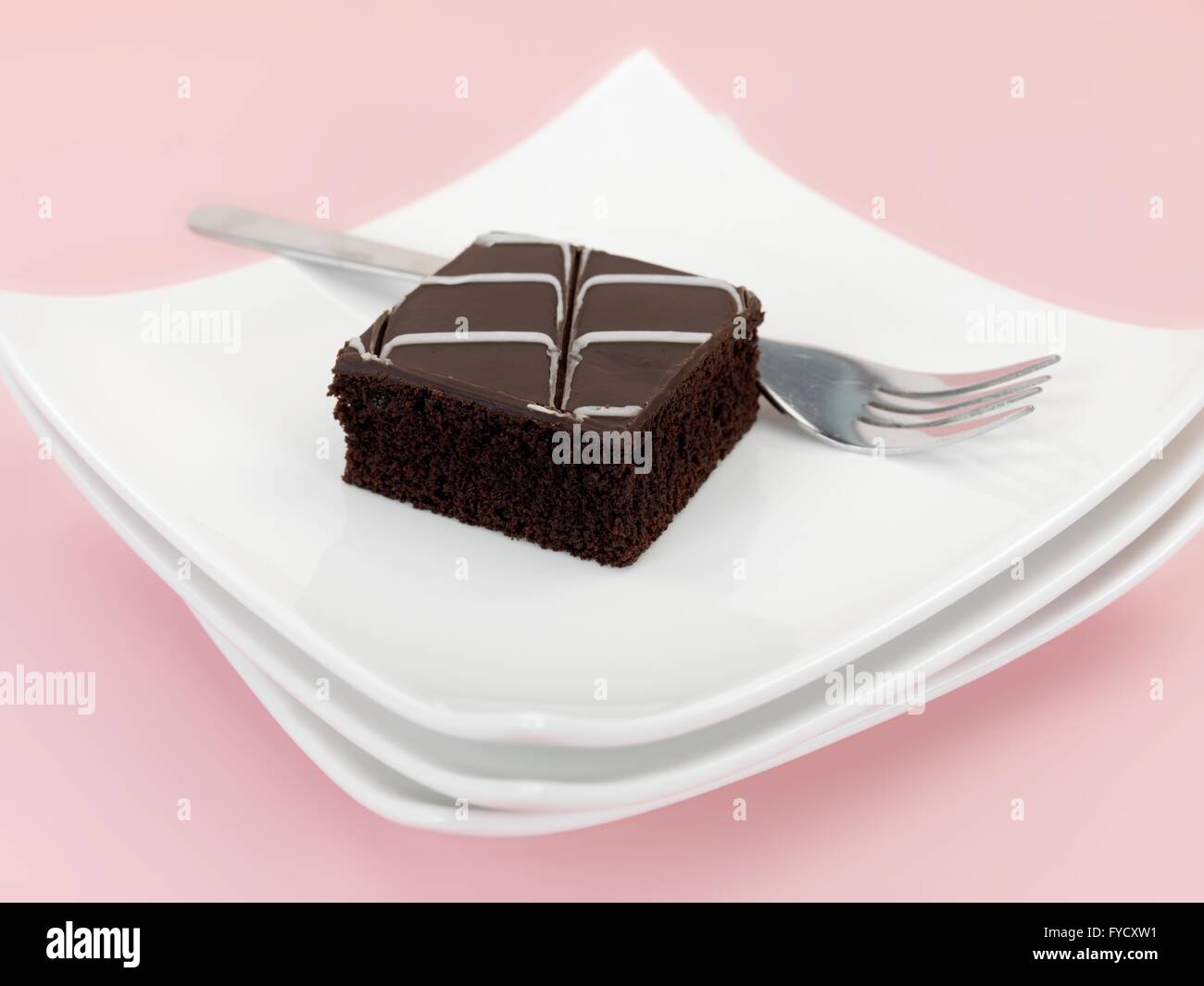 Chocolate mud cake slices isolated against a pink background Stock ...