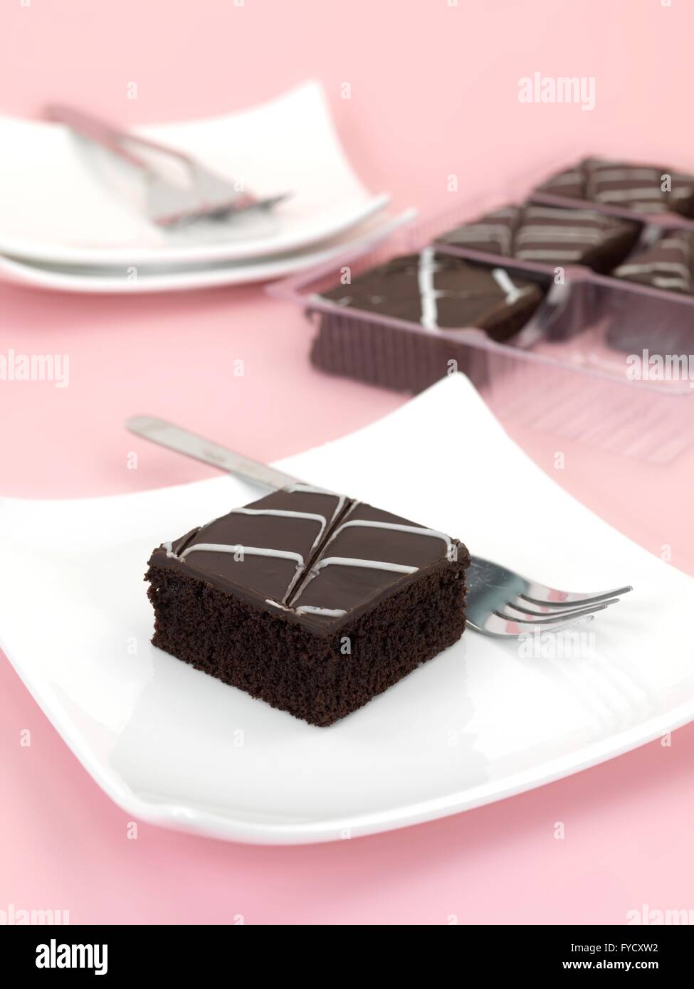 Chocolate mud cake slices isolated against a pink background Stock ...