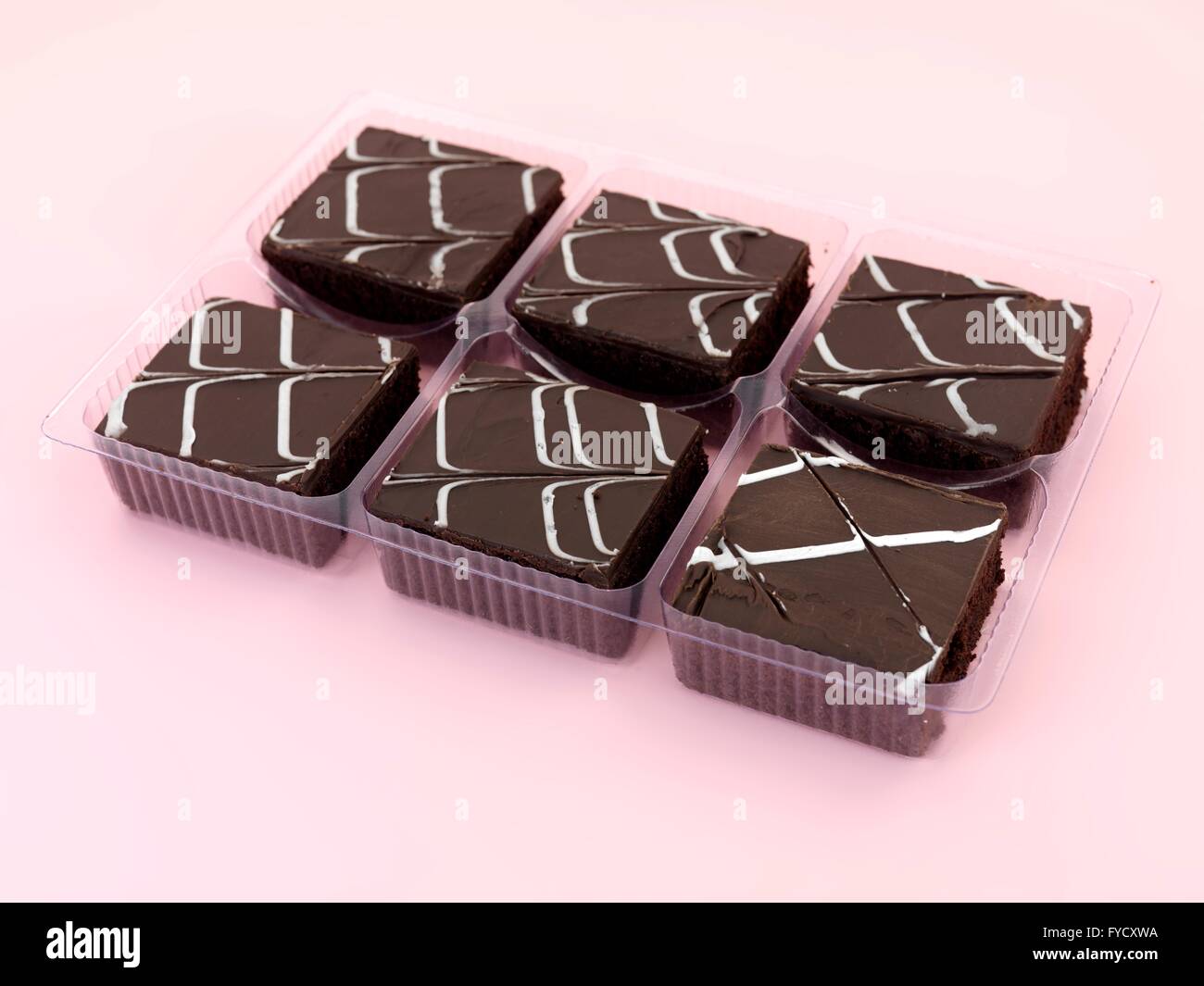 Chocolate mud cake slices isolated against a pink background Stock ...