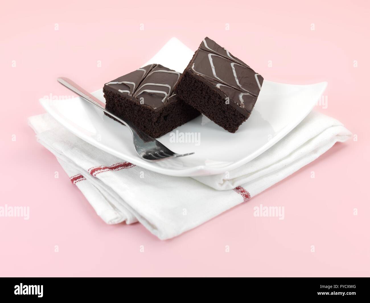 Chocolate mud cake slices isolated against a pink background Stock ...