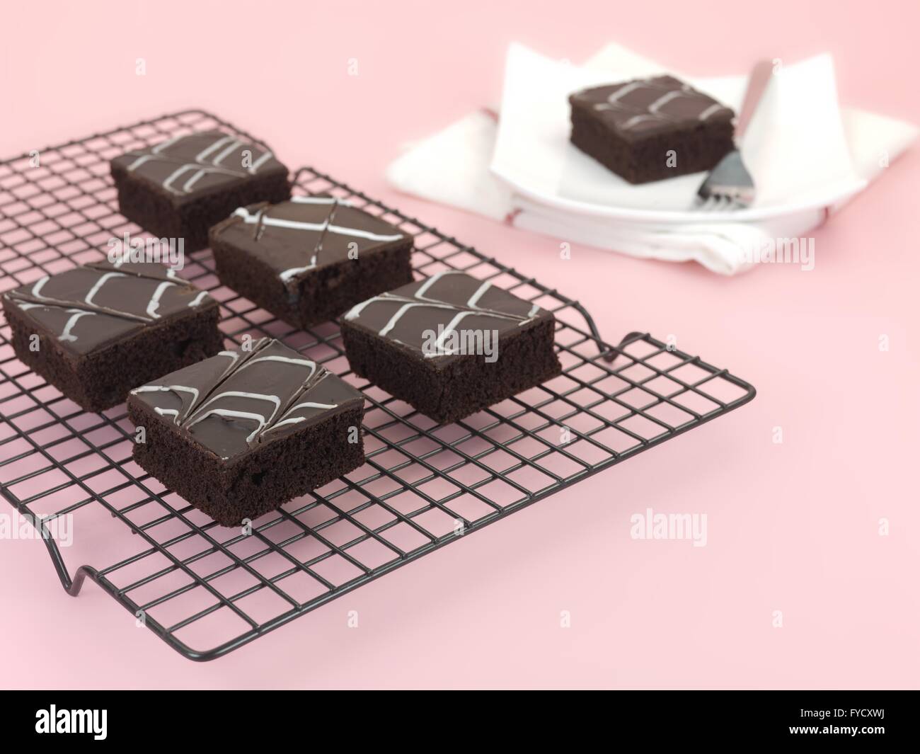 Chocolate mud cake slices isolated against a pink background Stock ...