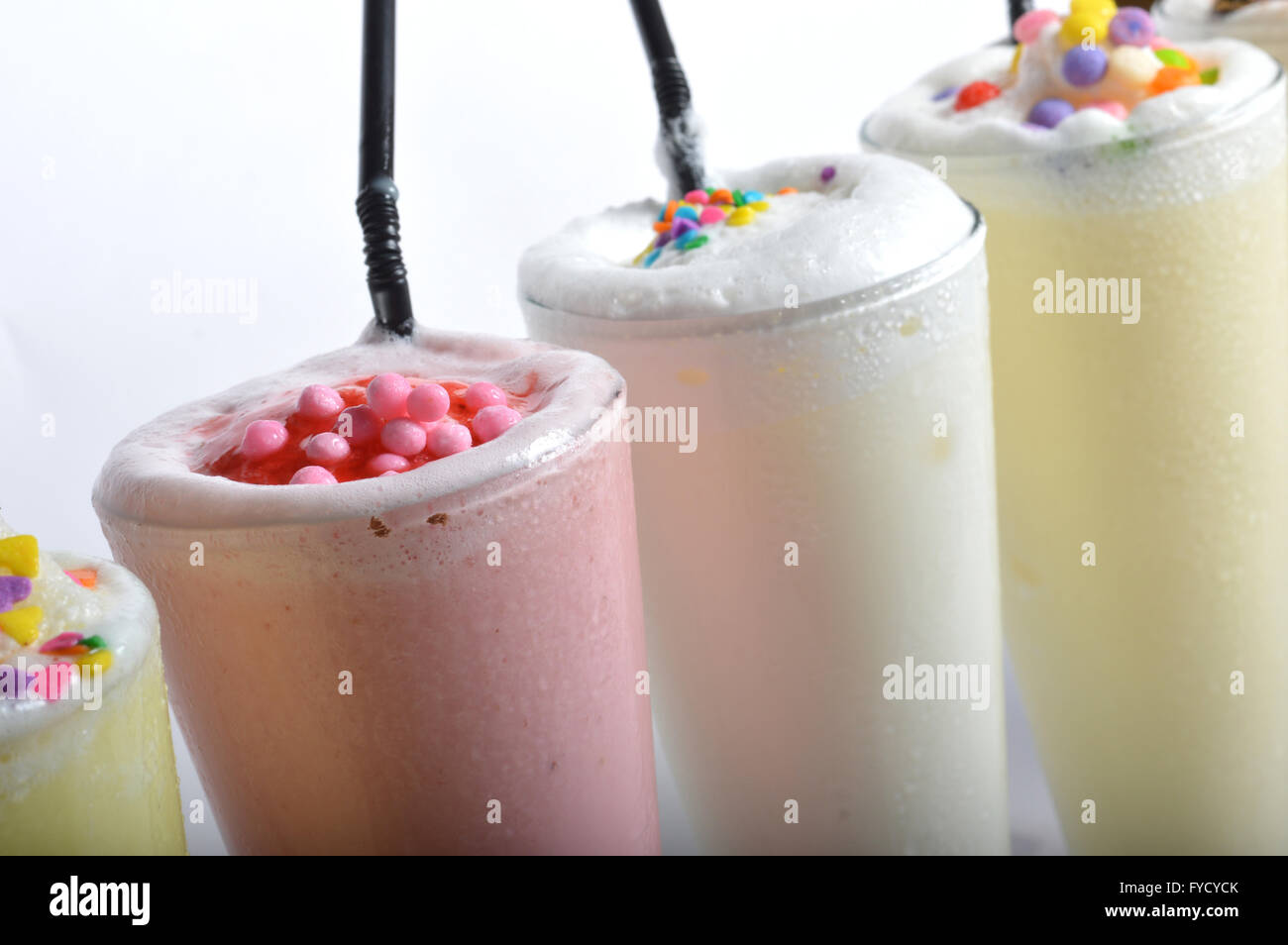 four types of milkshake drink on white background Stock Photo - Alamy