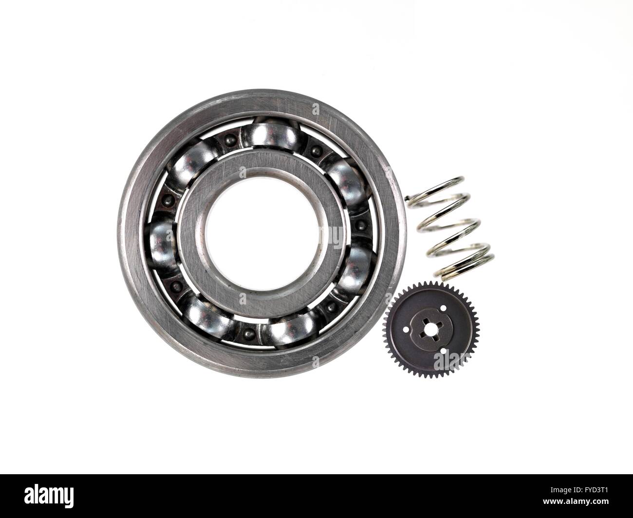 A bearing spring and gear isolated against a white background Stock ...