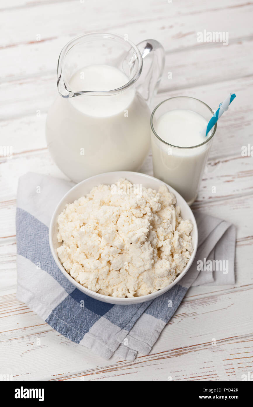 Milk jar on wooden table Stock Photo - Alamy