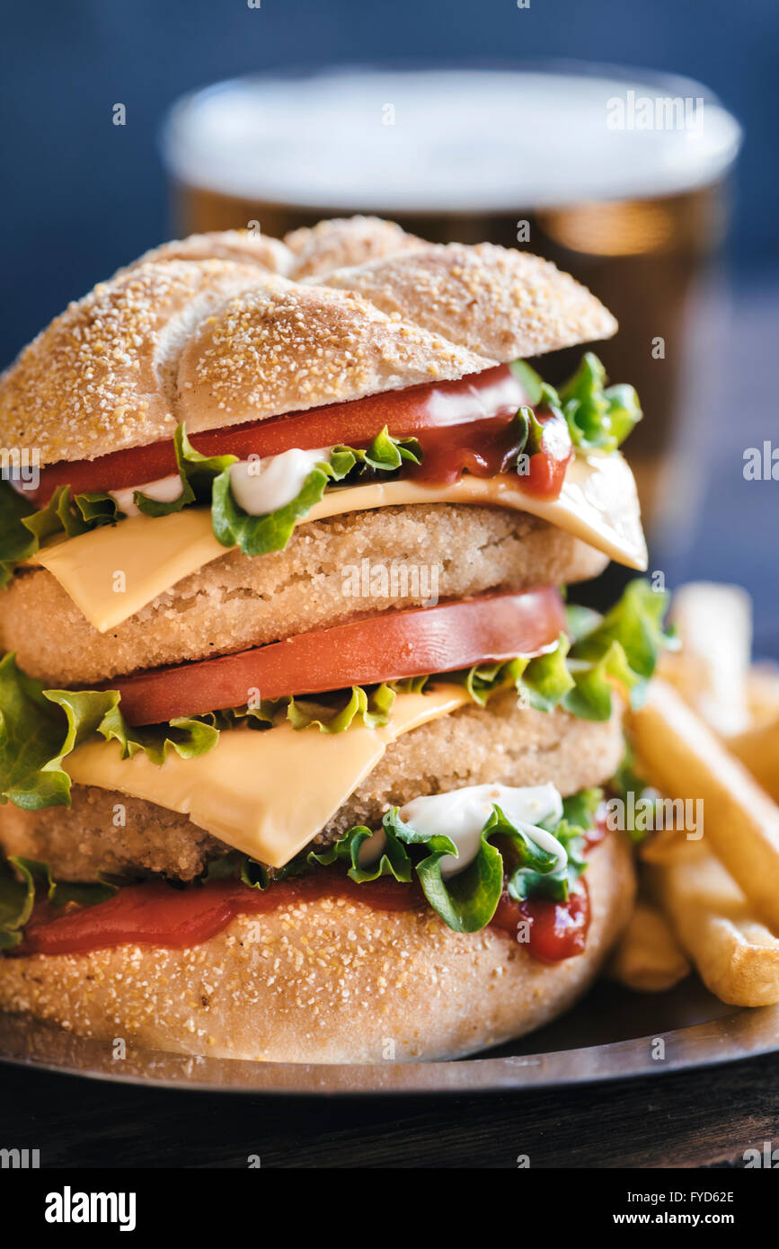 Big and juicy fish burger with french fries,selective focus Stock Photo ...