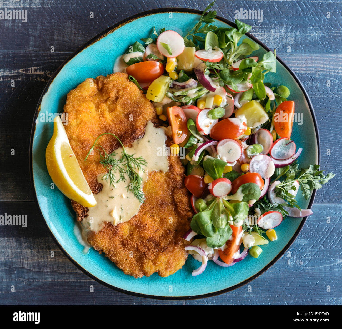 Served fried catfish fillet and salad in the plate Stock Photo - Alamy