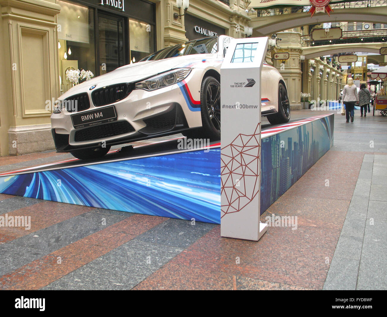 100 years of the BMW. The State Department Store. Moscow. White BMW M4 ...