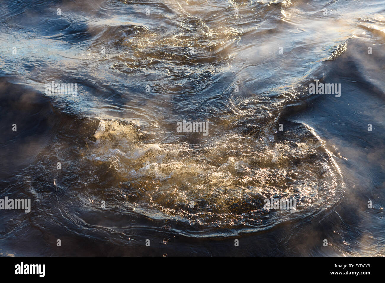 Water vapor on surface of cold icy water at sunny cold winter day Stock ...