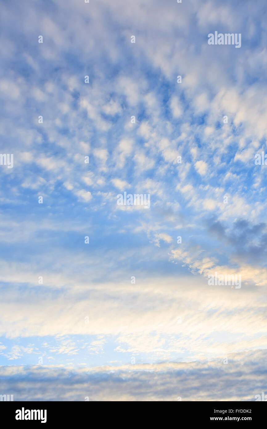 Calm sunset clouds and blue sky Stock Photo - Alamy