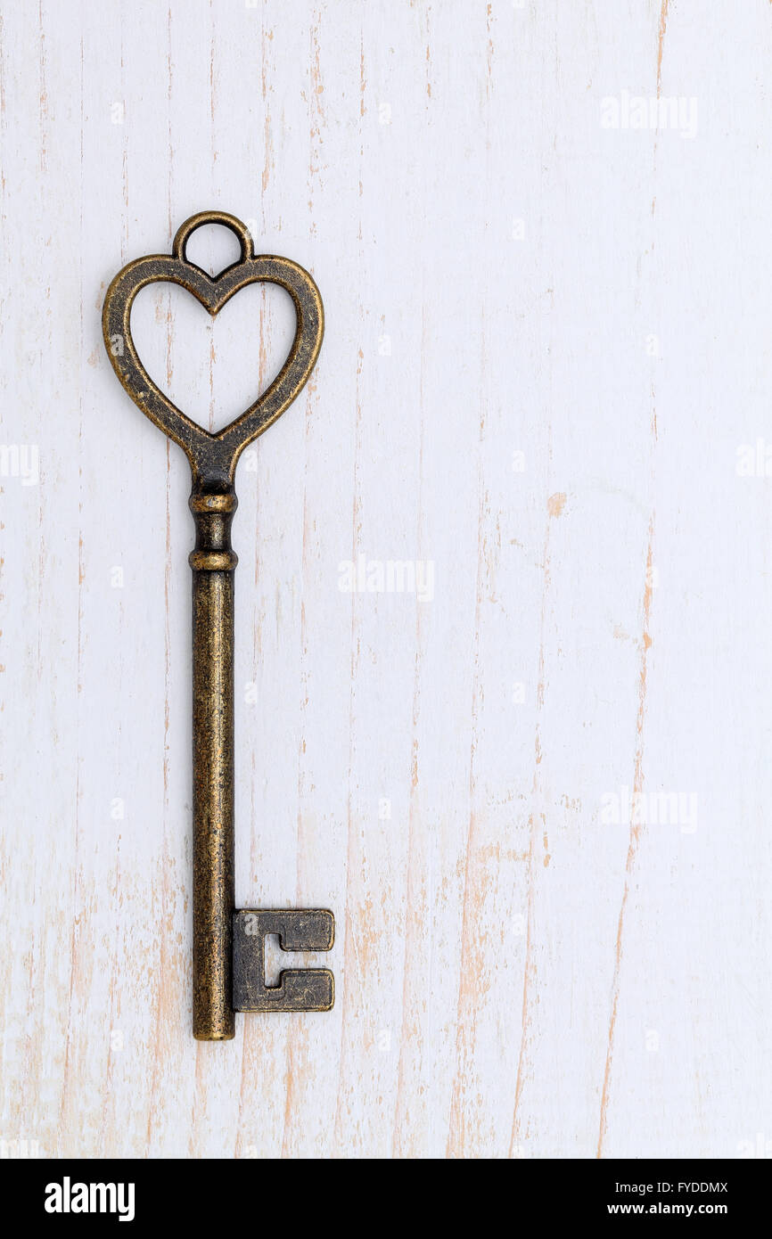 vintage key heart shape on white wood background Stock Photo - Alamy