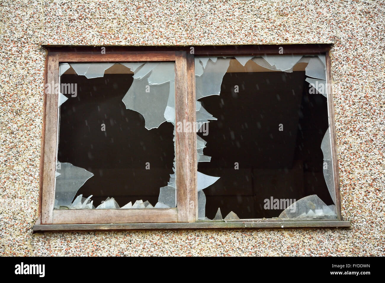Broken window caused by vandalism and rain getting in Stock Photo - Alamy