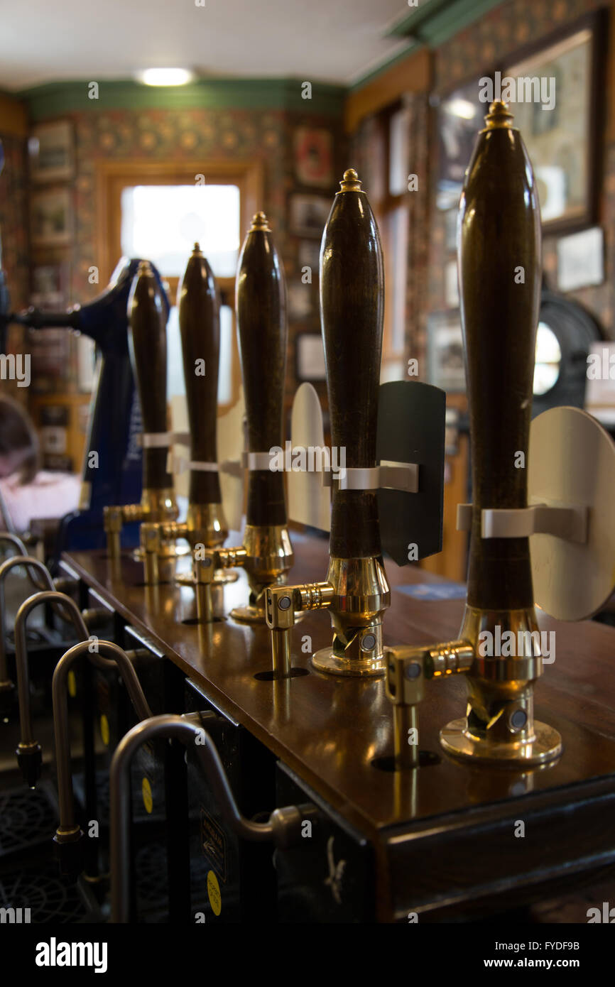 A view of English Victorian Pub/bar Real Ale pumps from behind the ...