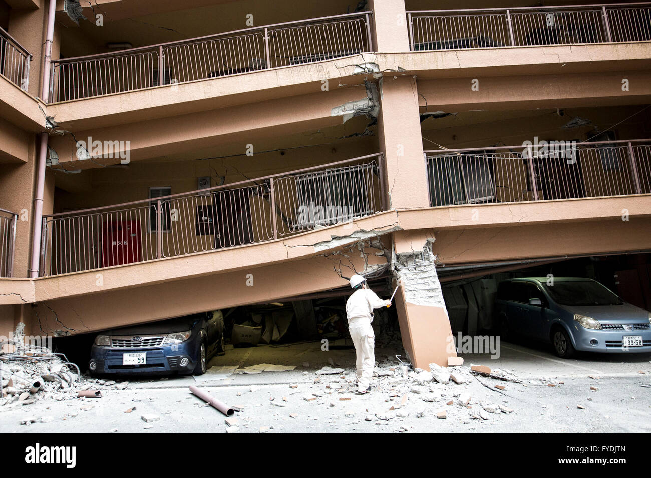KUMAMOTO, JAPAN - APRIL 16: City officers check cracked foundation of ...