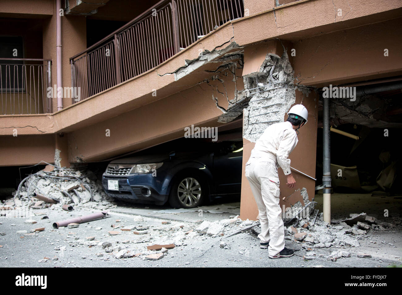 KUMAMOTO, JAPAN - APRIL 16: City officers check cracked foundation of ...