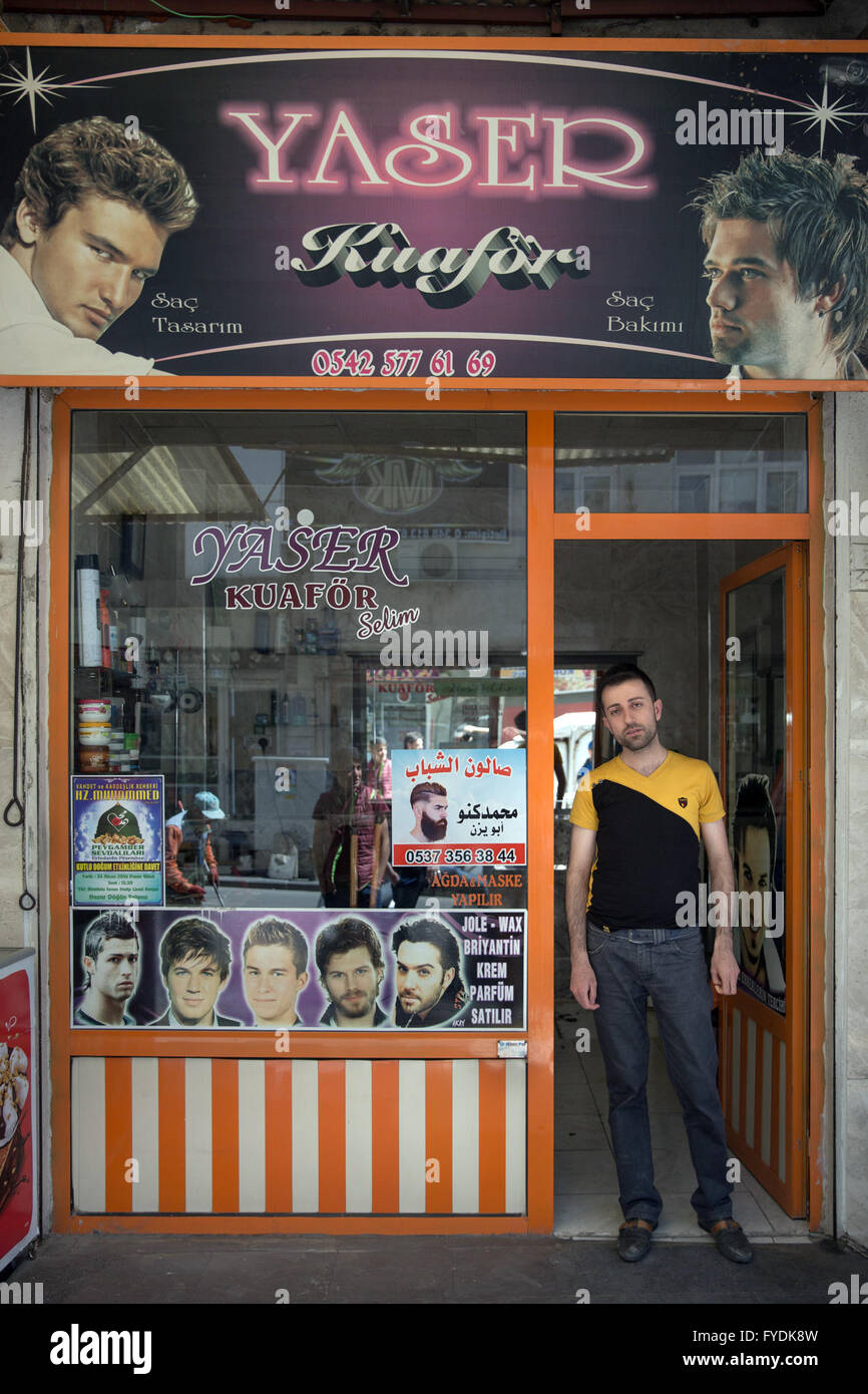 Portrait of a turkish barber shop owner Mustafa Schahabeddin (25) whose ...