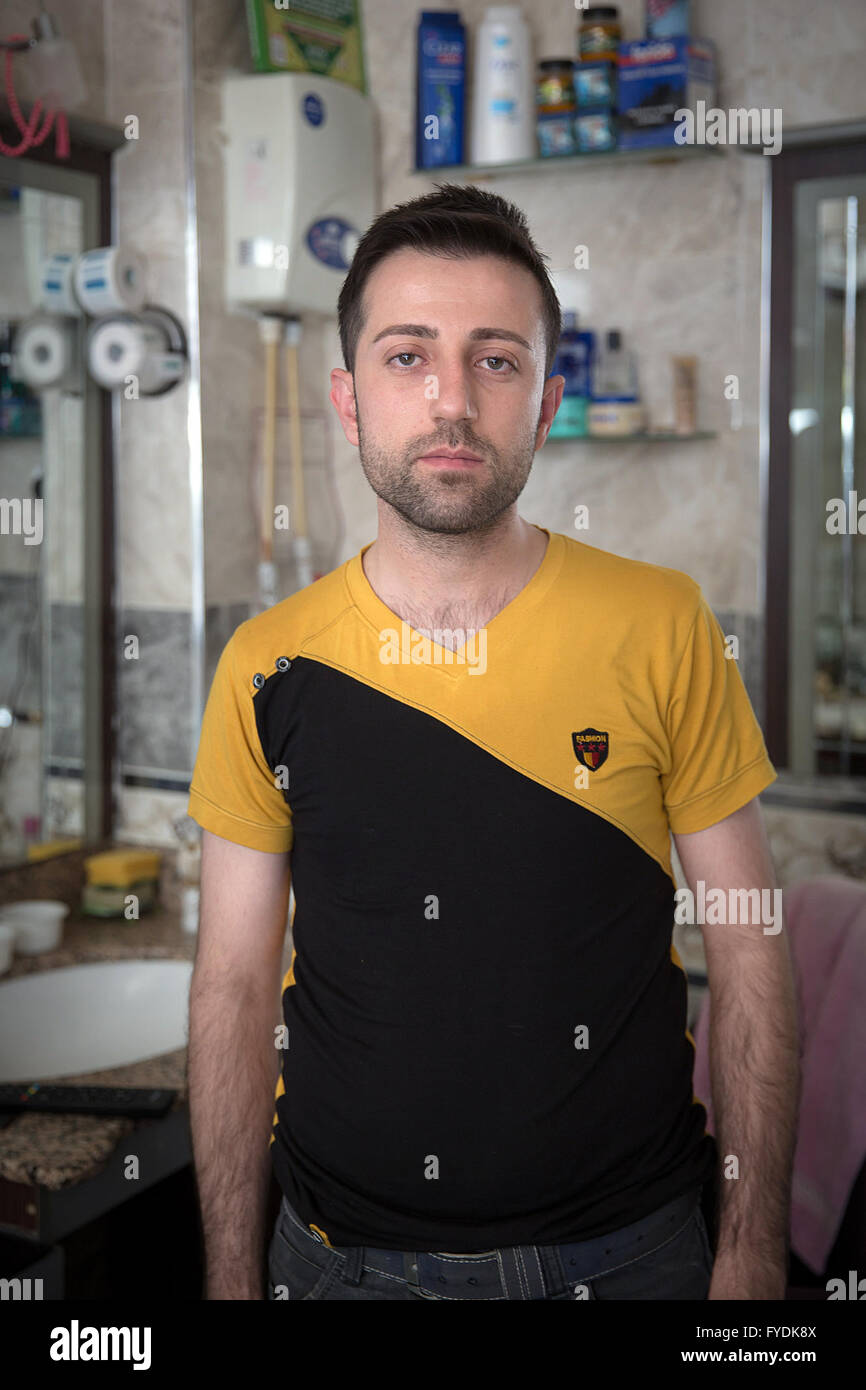 Portrait of a turkish barber shop owner Mustafa Schahabeddin (25) whose ...