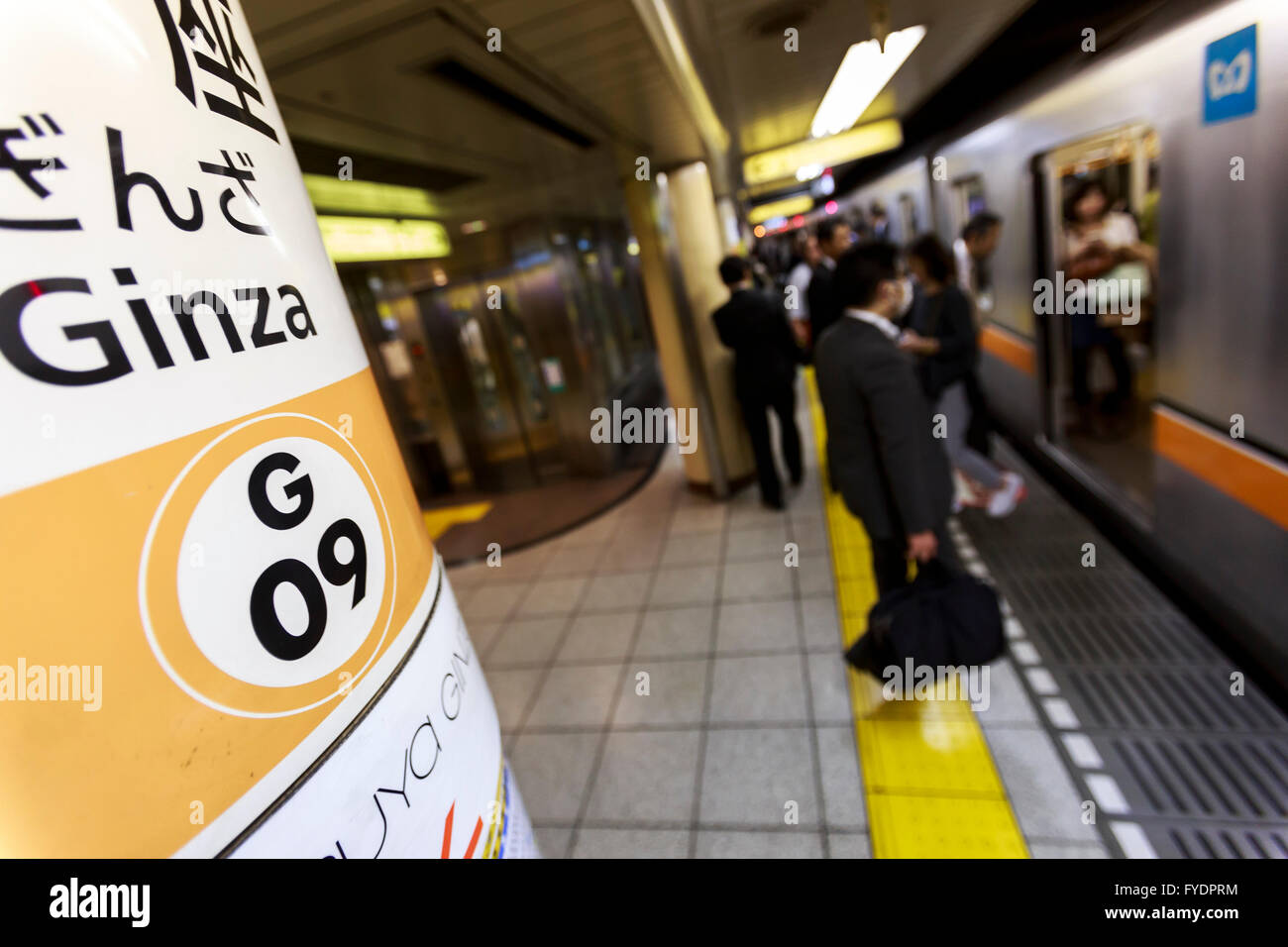 Tokyo, Japan. 26th April, 2016. Tokyo Metro commuters walk past a Ginza ...