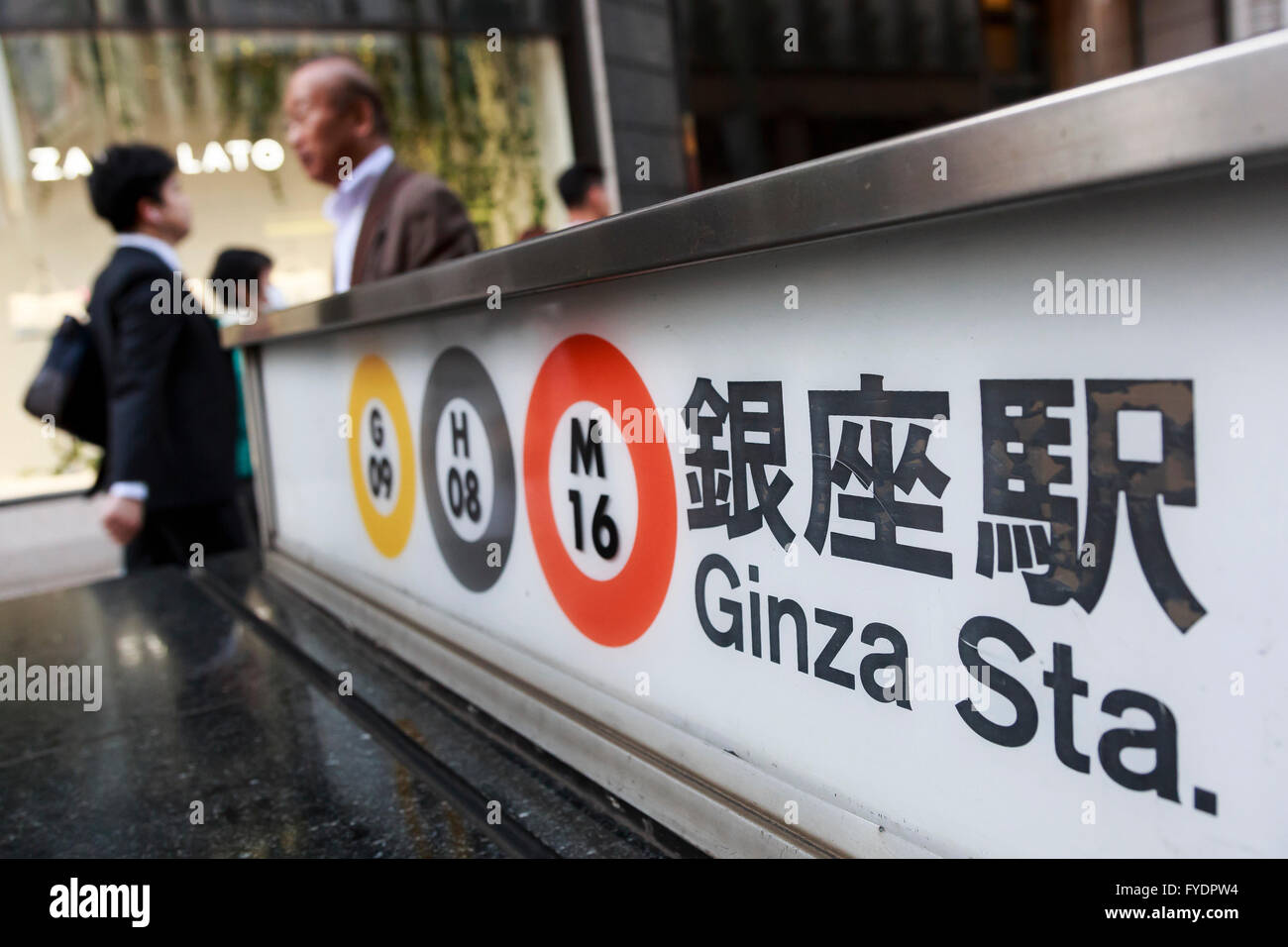 Tokyo, Japan. 26th April, 2016. Pedestrians walk past a Ginza station ...