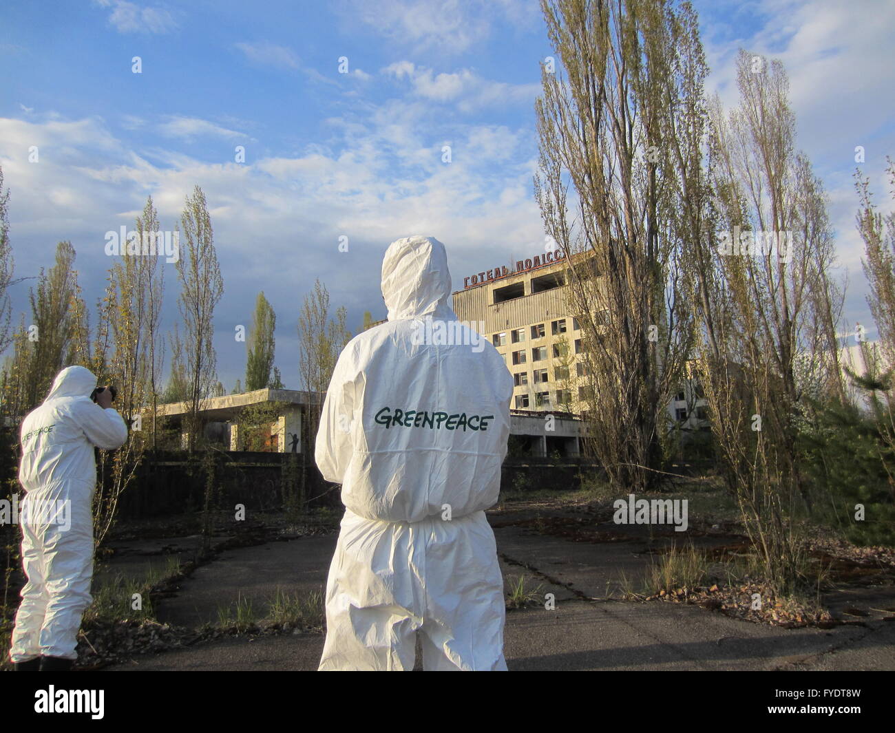 Greenpeace employees in protective clothes visiting the city of Prypyat ...