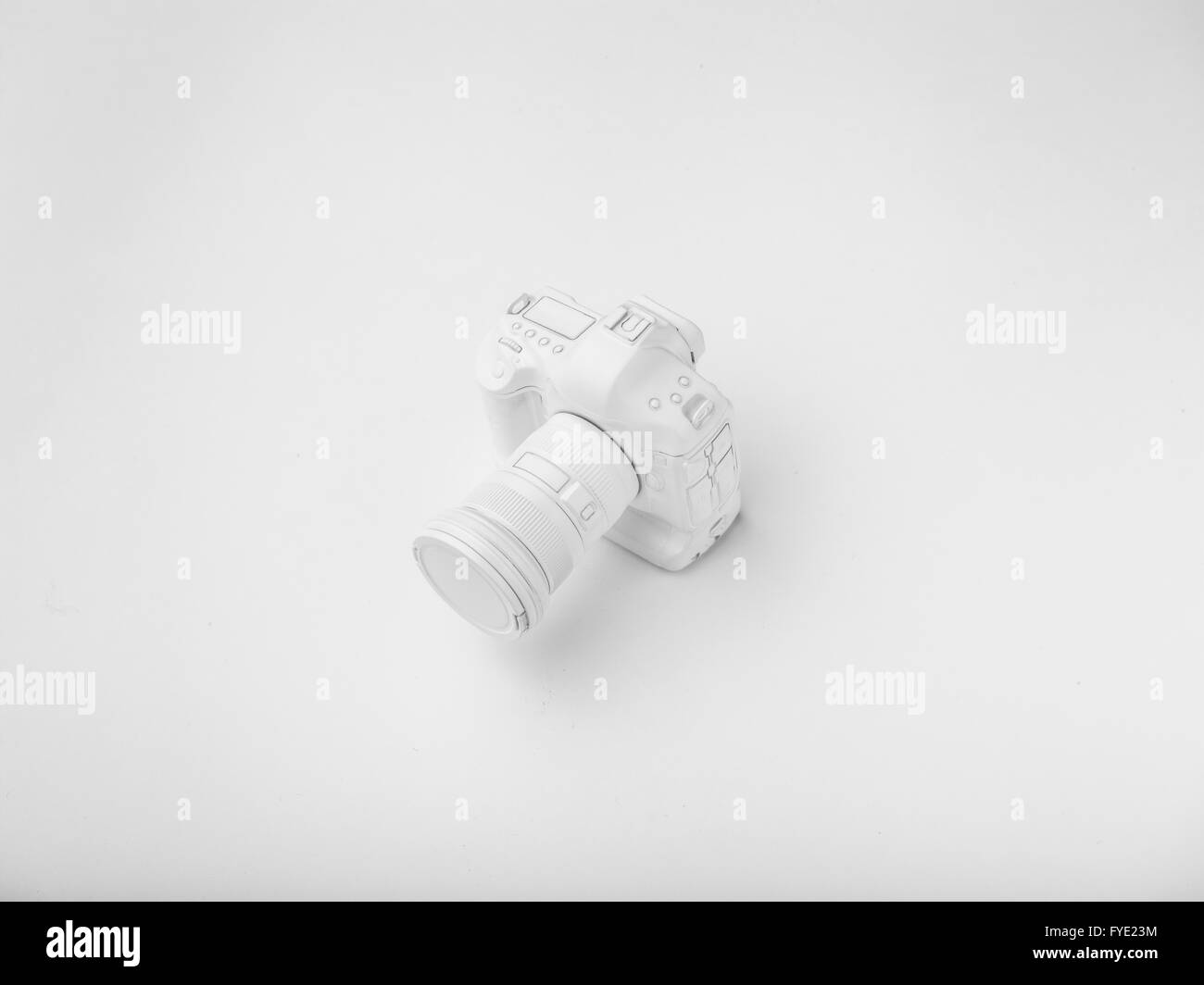 A white canon DSLR and lens against a plain white background Stock ...