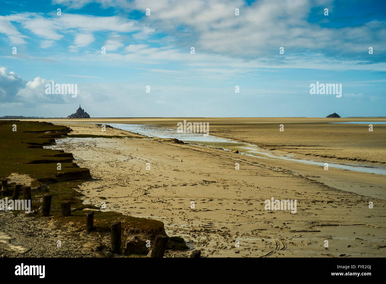 The tidal Bay of Mont Saint-Michel with the mont on the horizon with a ...