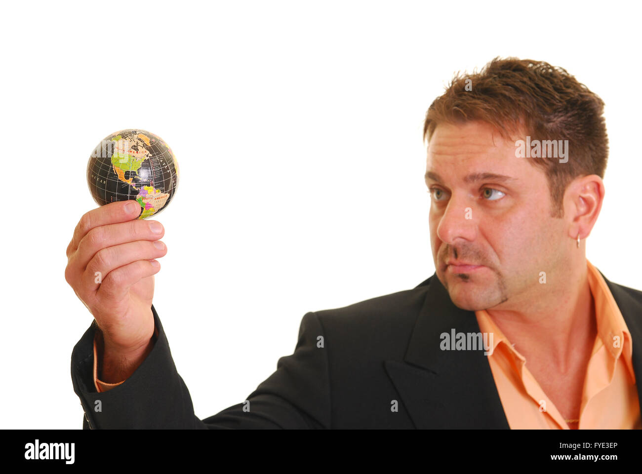 Man gazing at globe Stock Photo - Alamy