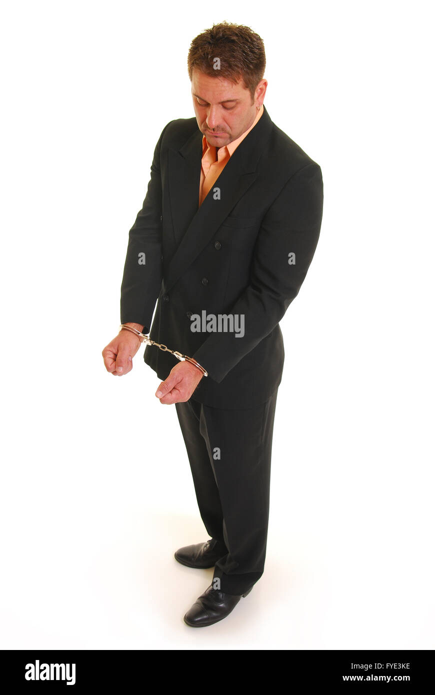 Man handcuffed suit hi-res stock photography and images - Alamy