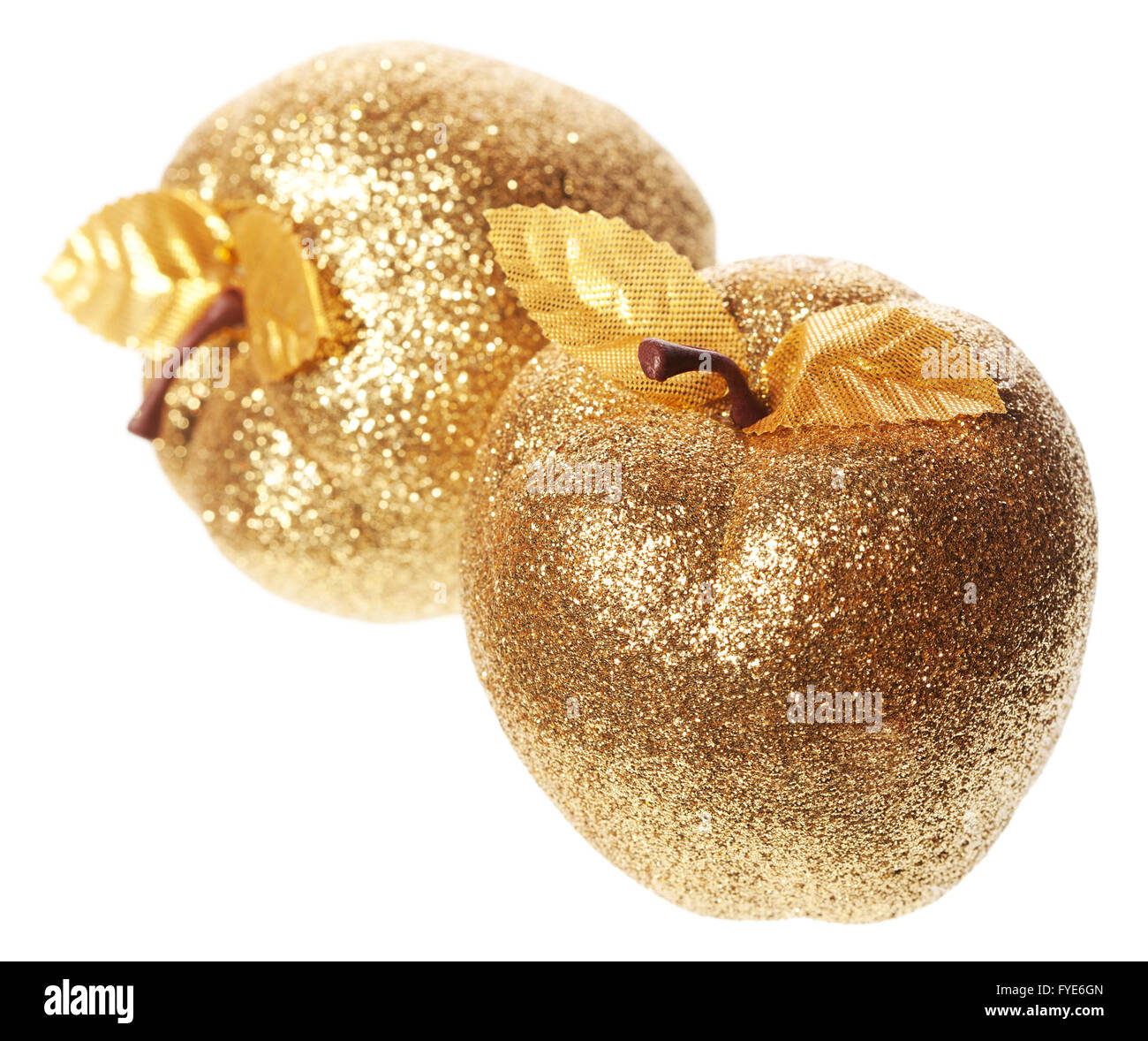 Golden apple lying on a white background Stock Photo - Alamy