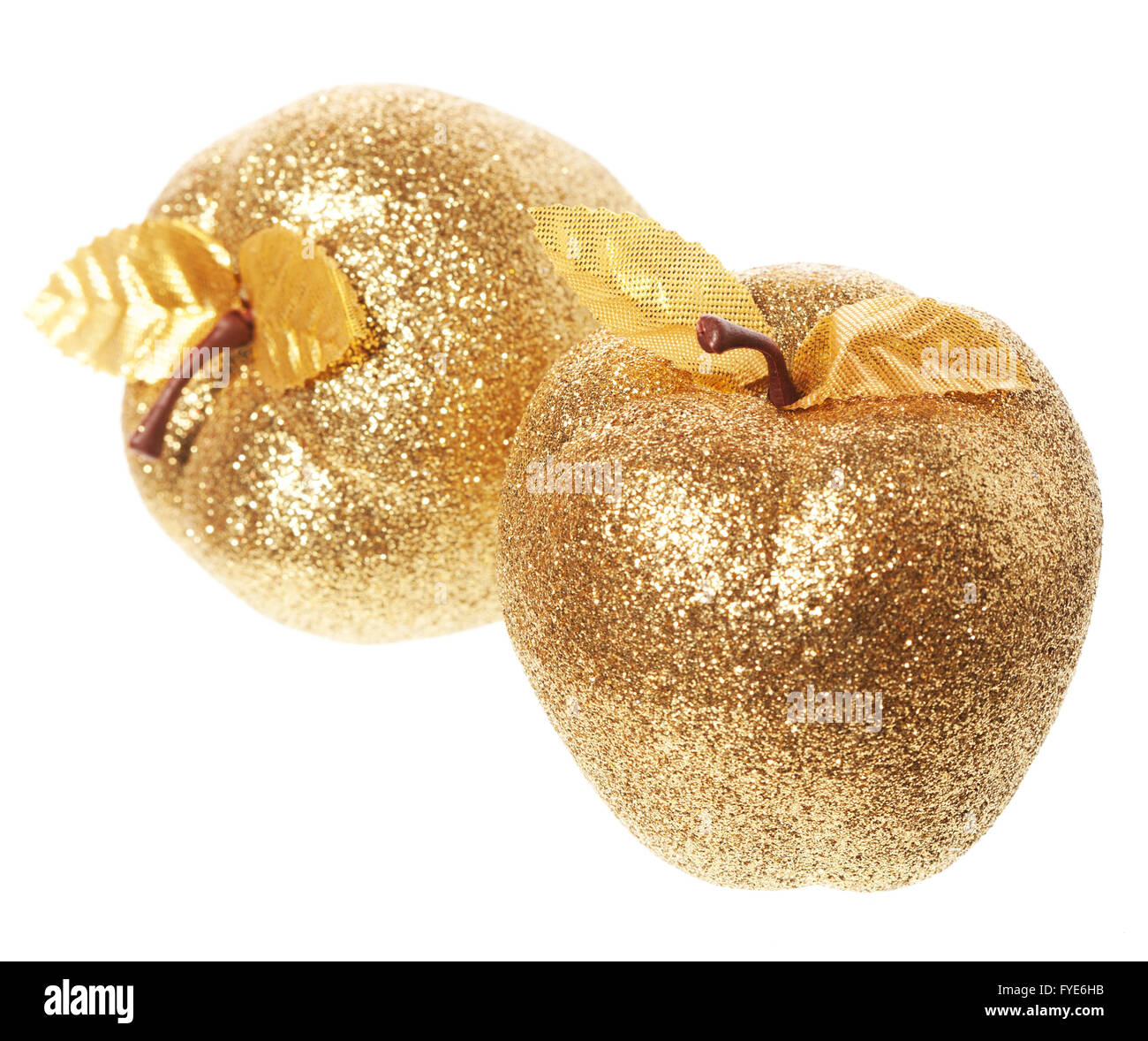 Golden apple lying on a white background Stock Photo - Alamy