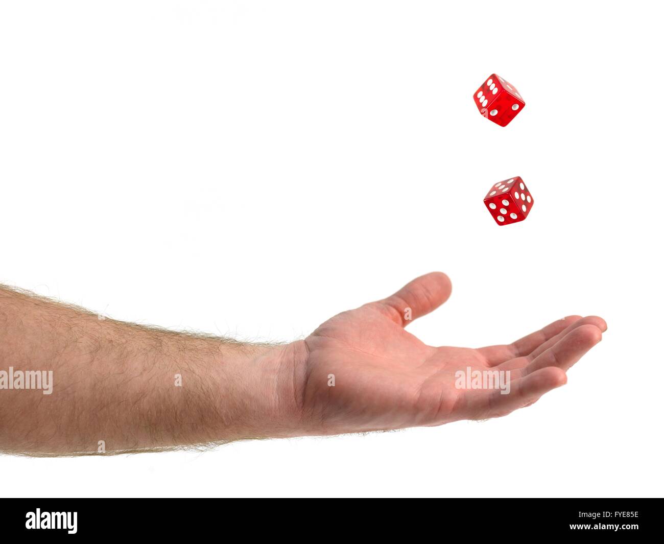 A hand and die isolated against a white background Stock Photo - Alamy