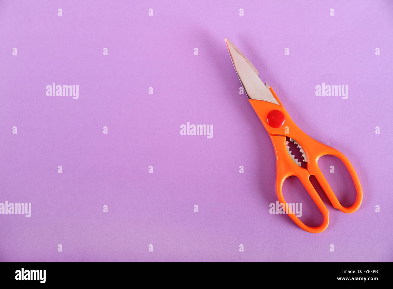 Scissor on a Paper Background Stock Photo - Alamy