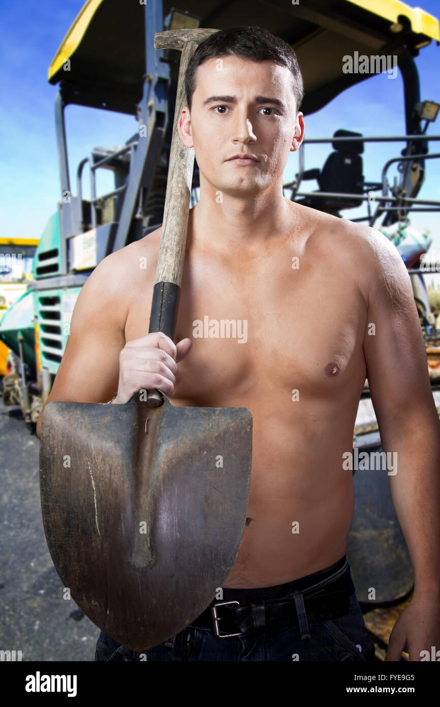 Worker on road street repairing works Stock Photo - Alamy
