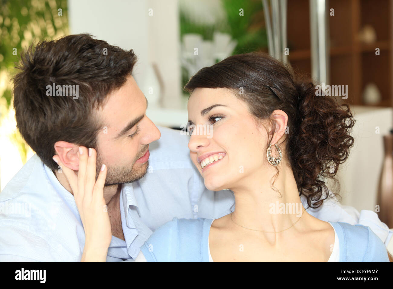 Couple staring lovingly into each other's eyes Stock Photo - Alamy
