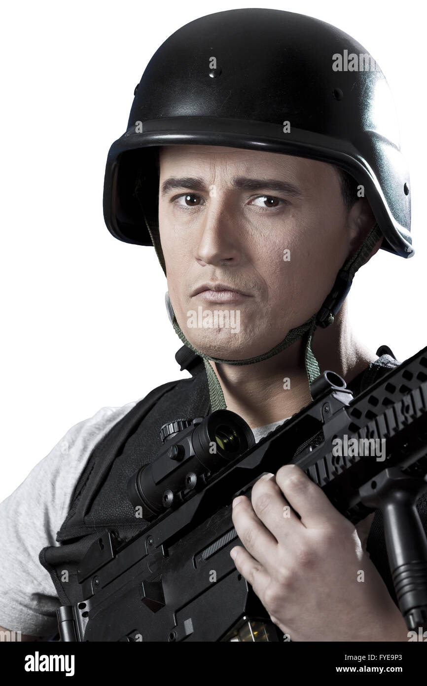 Armed military in protective cask with a weapon Stock Photo - Alamy