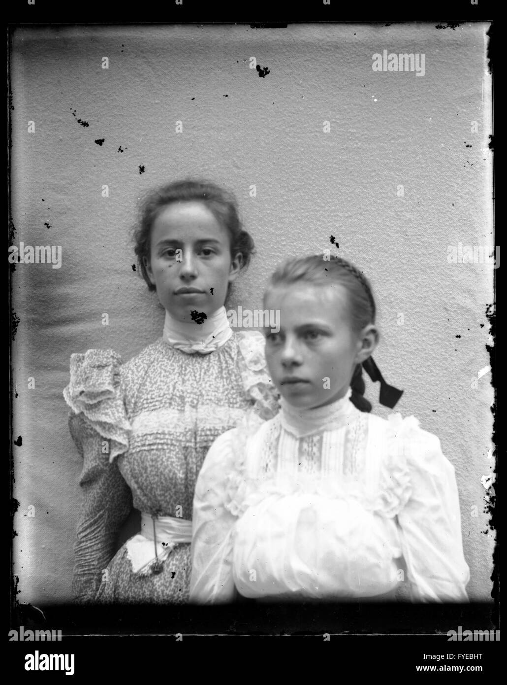 Victorian photograph of two girls getting their portrait taken Stock ...