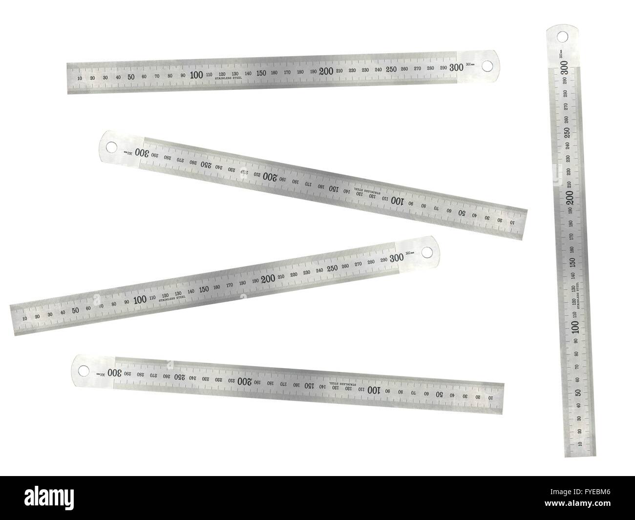 A metal ruler isolated against a white background Stock Photo - Alamy