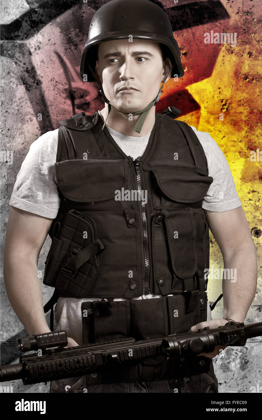 Armed police against urban texture background colors orange Stock Photo ...